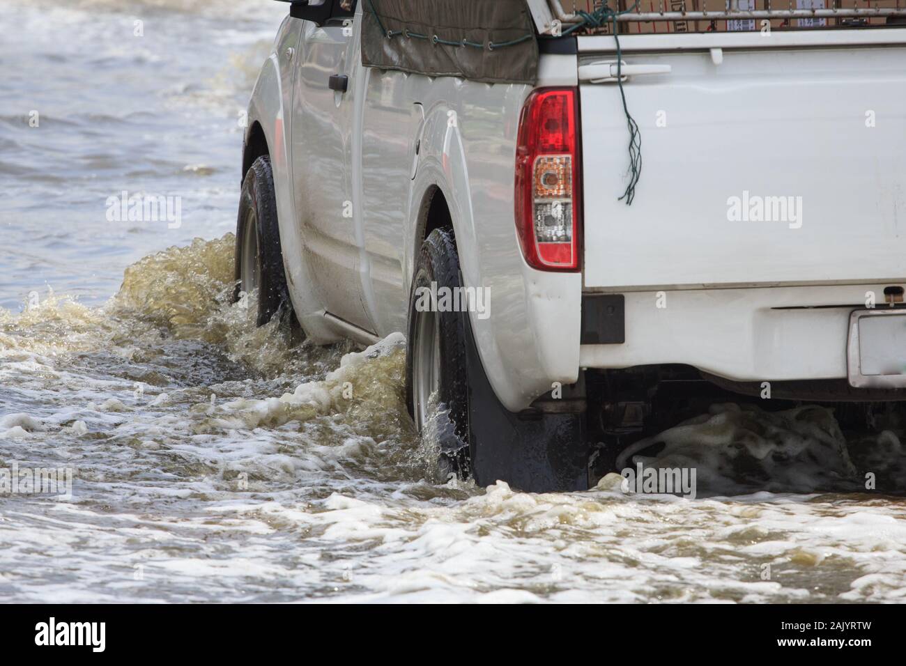 Car splashing through a puddle hi-res stock photography and images - Alamy