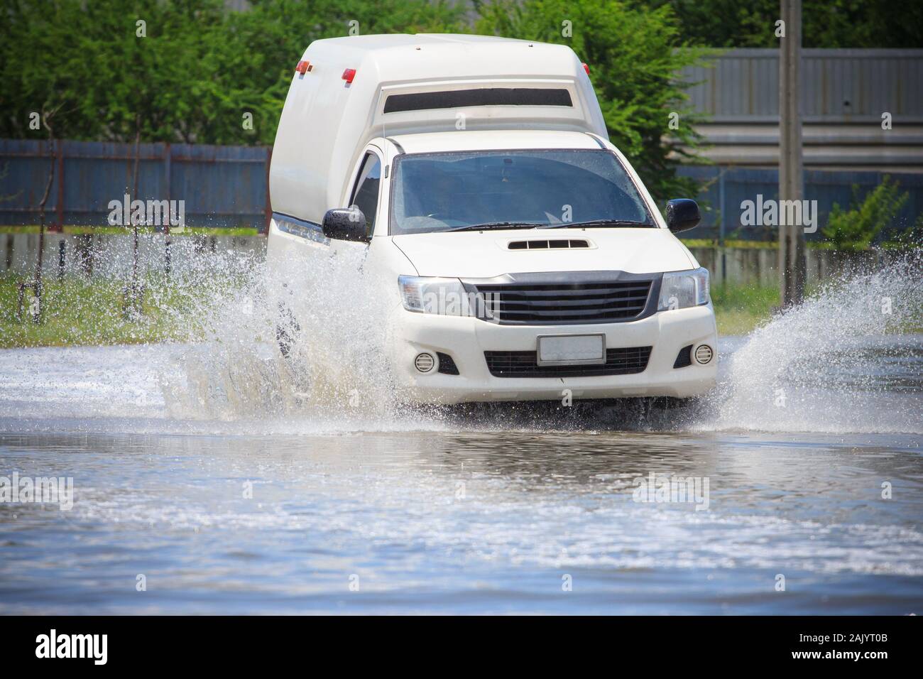 Torrential rain flood road car splash traffic hi-res stock photography ...