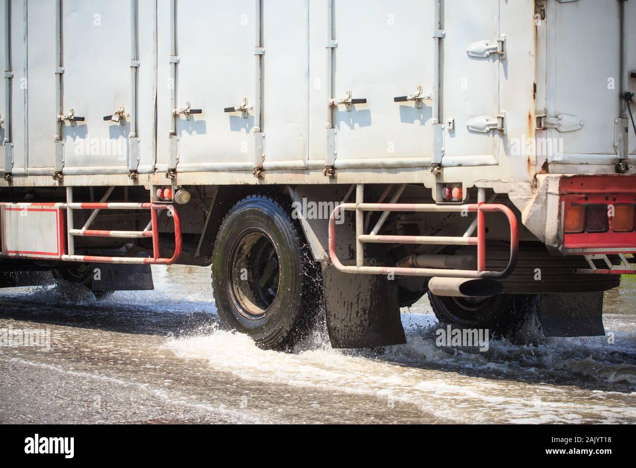 Car goes through puddle hi-res stock photography and images - Alamy