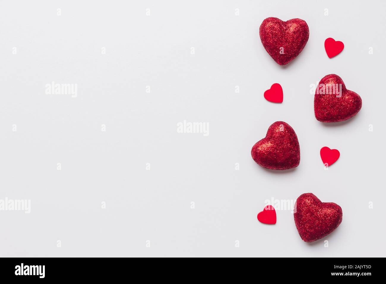 Stock photo of big and small red hearts on a white background. Hearts ...