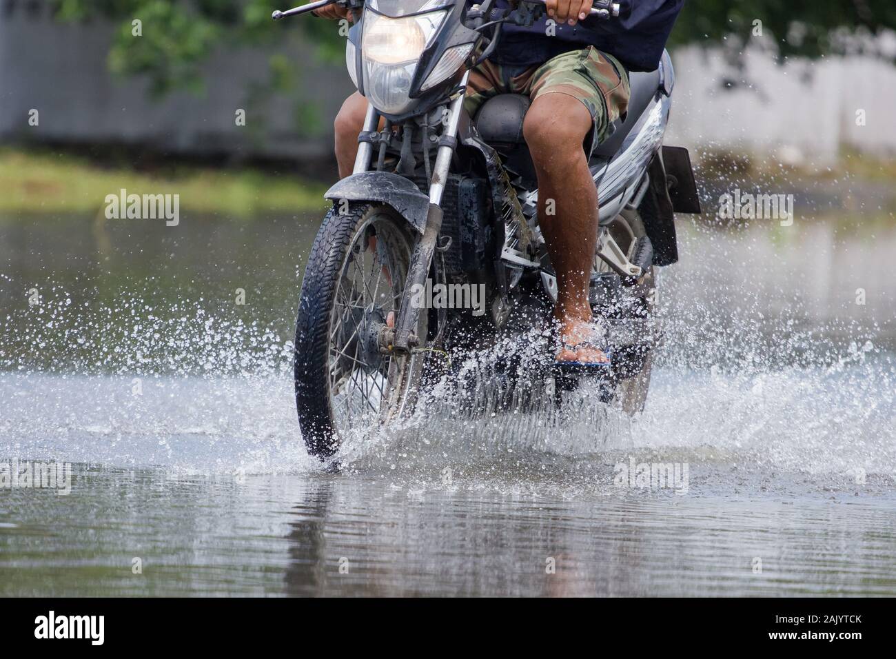 Bike through flood water hi-res stock photography and images - Alamy