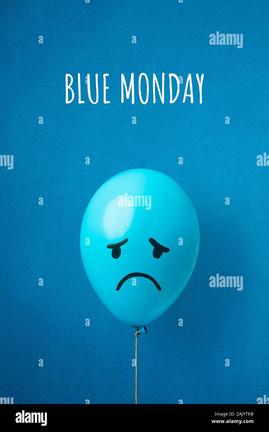 Stock photo of a blue balloon on a blue background with a sad face ...