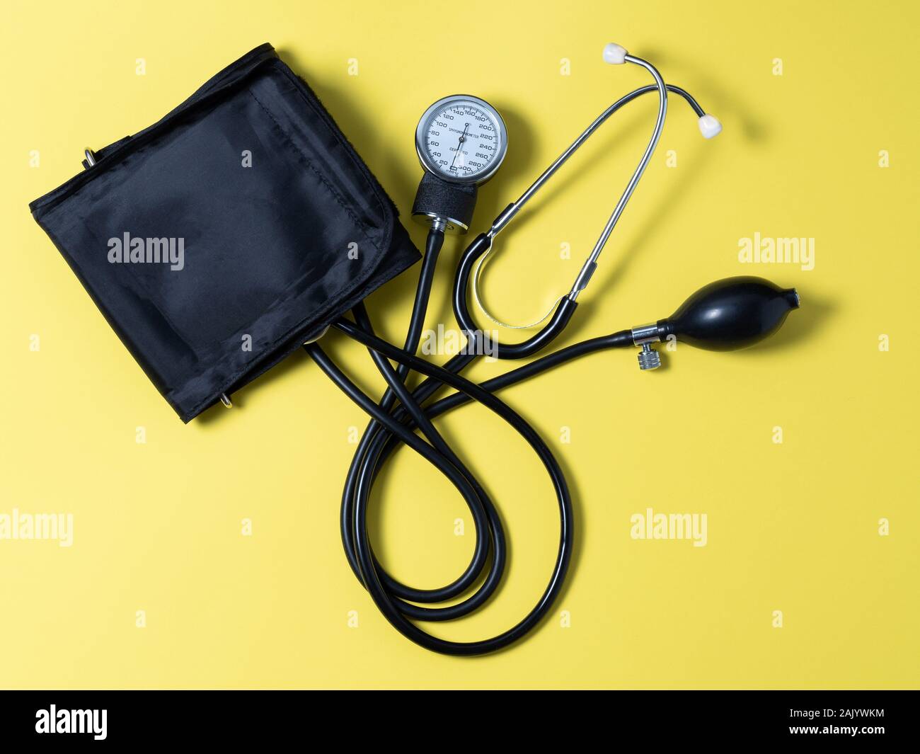 sphygmomanometer close-up on a yellow background . medical device to ...