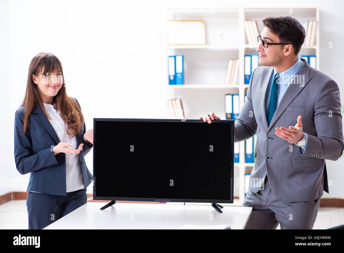 The young employee making presentation to his female boss Stock Photo ...