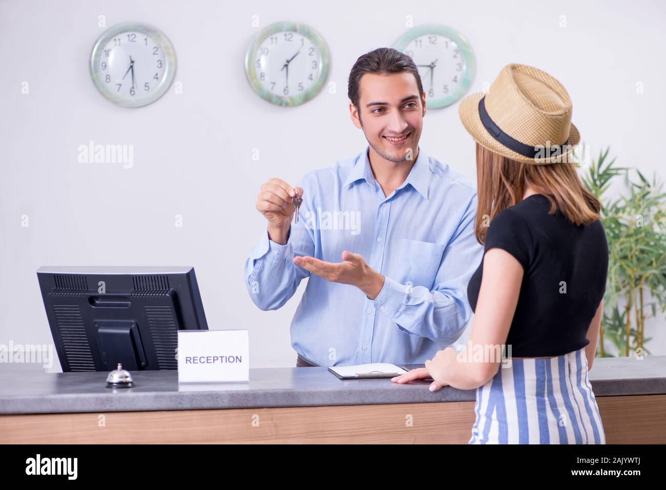 The young woman at hotel reception Stock Photo - Alamy