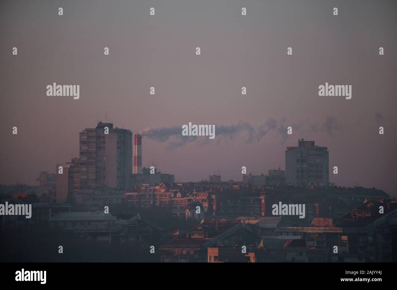 Smoking from industrial chimneys of heating plant emits smoke, smog ...