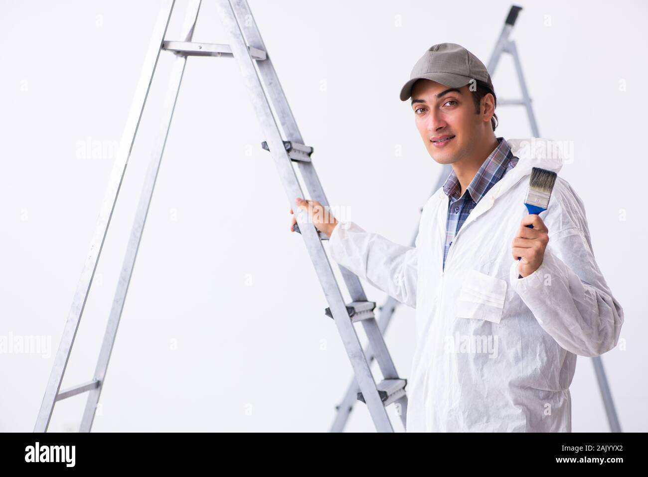 Painter working at the construction site Stock Photo - Alamy