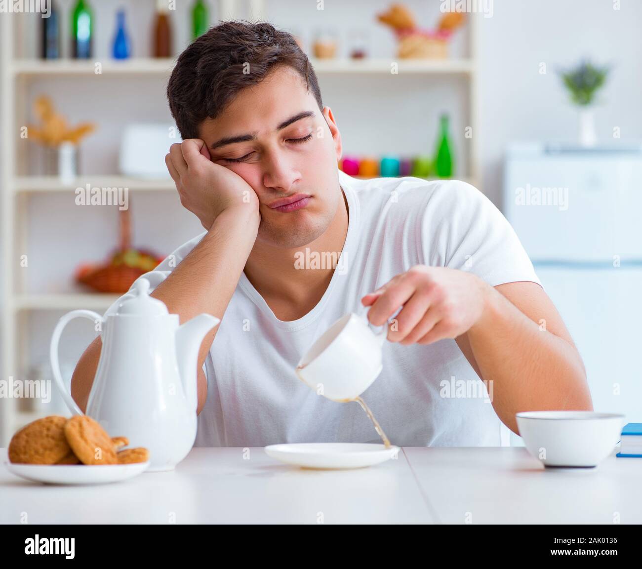 The man falling asleep during his breakfast after overtime work Stock ...
