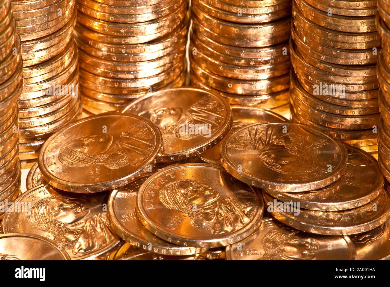Macro close-up of stacks of dollar gold coins with native american ...