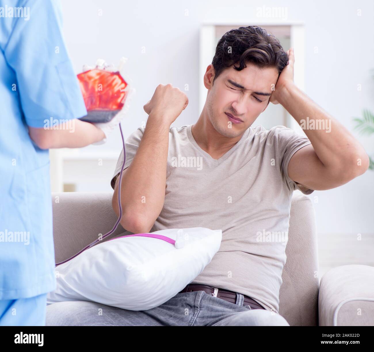 The patient getting blood transfusion in hospital clinic Stock Photo ...