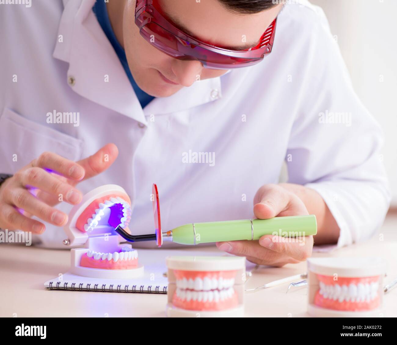 The dentist working teeth implant in medical lab Stock Photo - Alamy