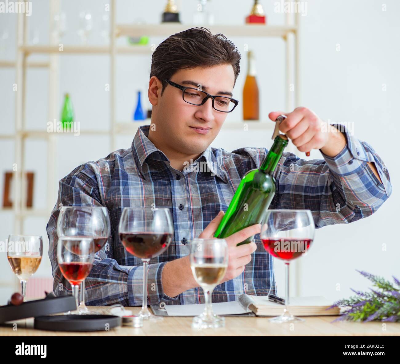 The professional sommelier tasting red wine Stock Photo - Alamy