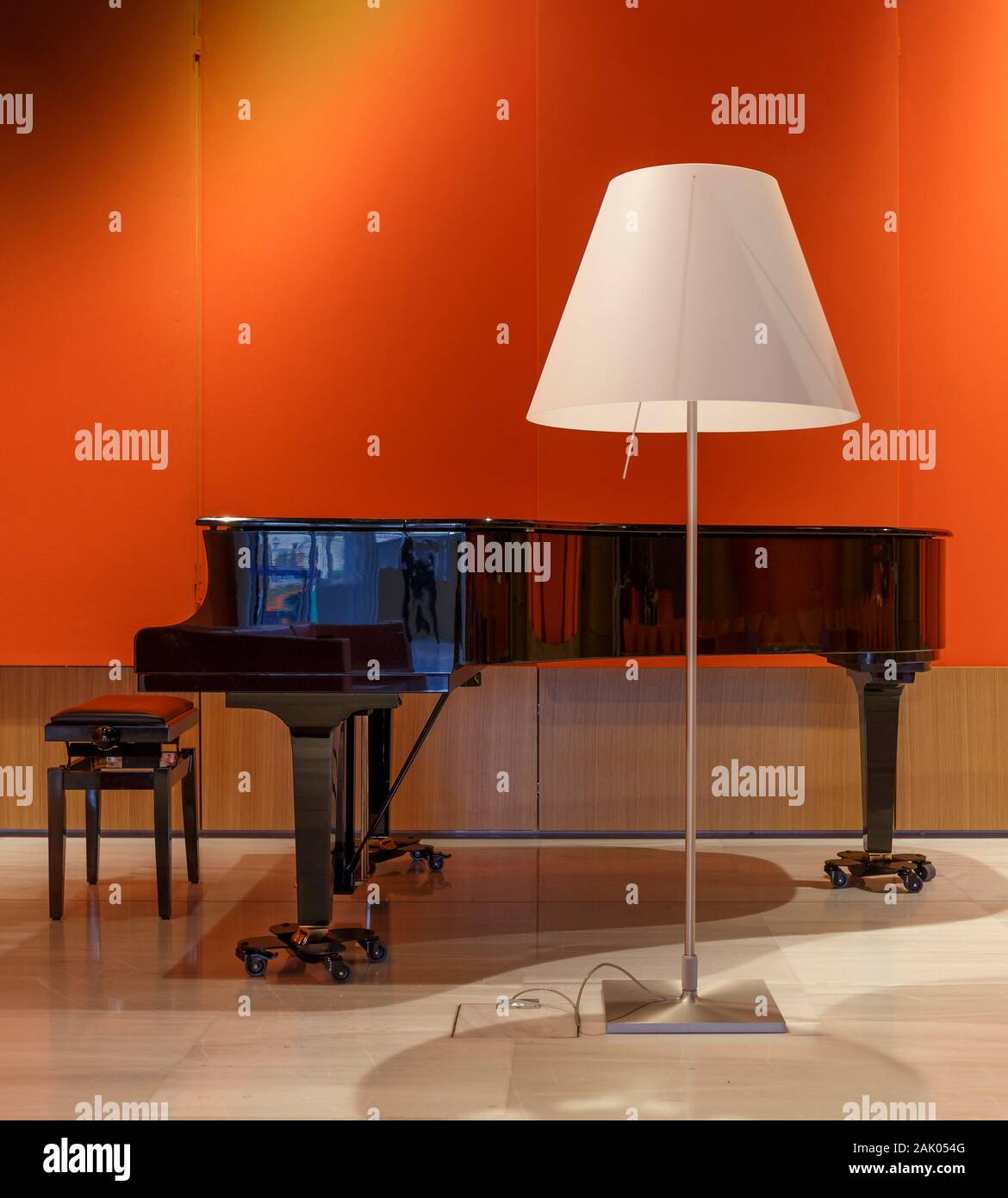 Piano in an orange room Stock Photo - Alamy