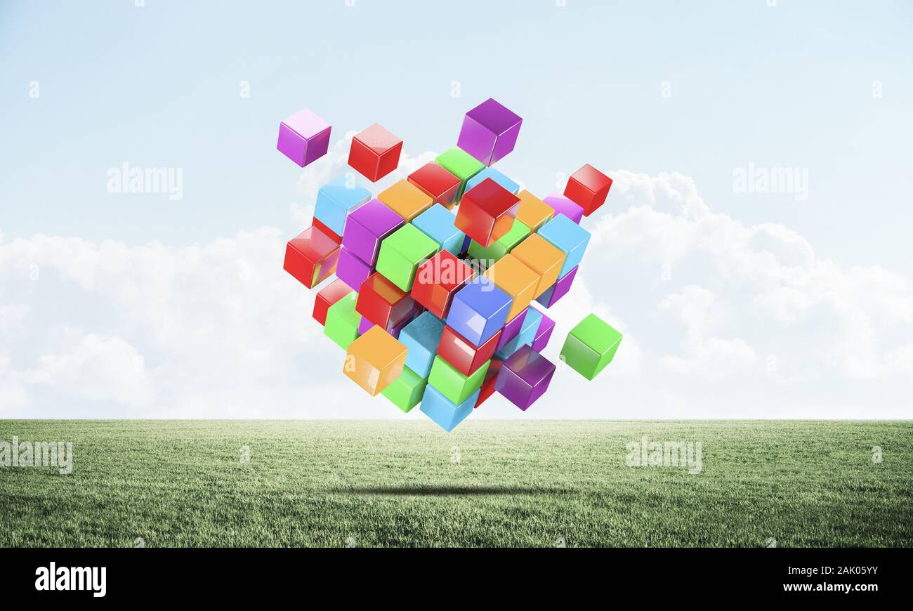 Abstract colorful cubes on green meadow Stock Photo - Alamy