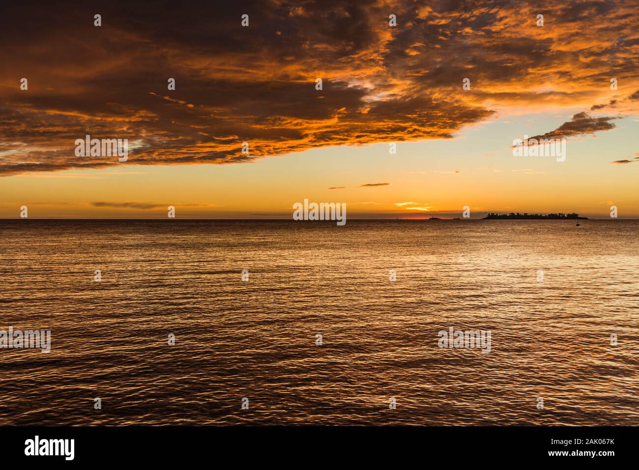 Landscape nature of sunset sky at the beach and colorful shiny sea ...