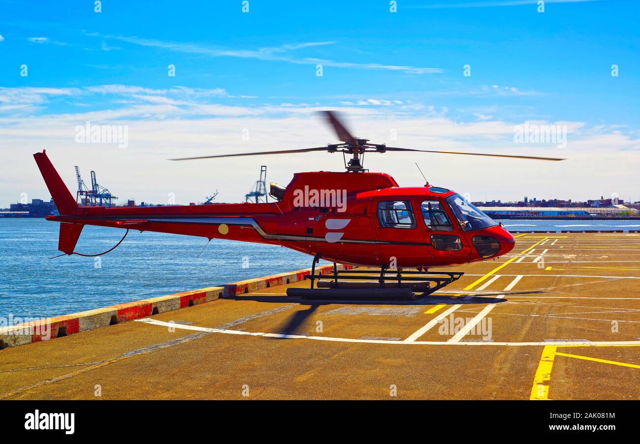 Red Helicopter on helipad in Lower Manhattan in New York reflex Stock ...