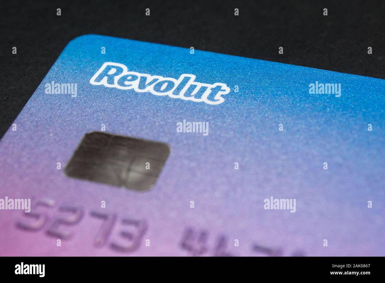 In this photo illustration a Revolut logo seen on a Mastercard debit ...