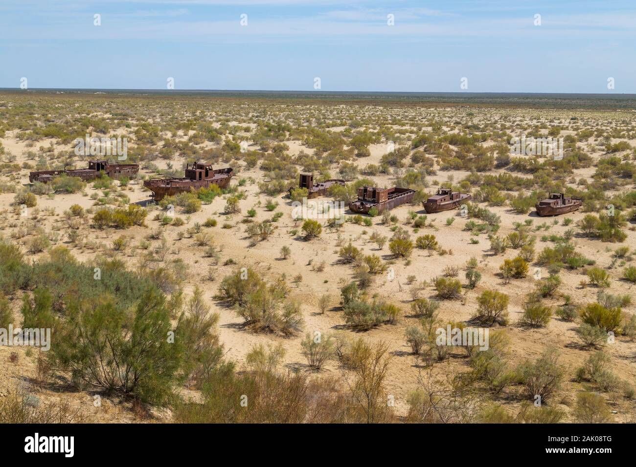 boats on a ship graveyard on a desert around Moynaq, Moynoq or Muynak ...