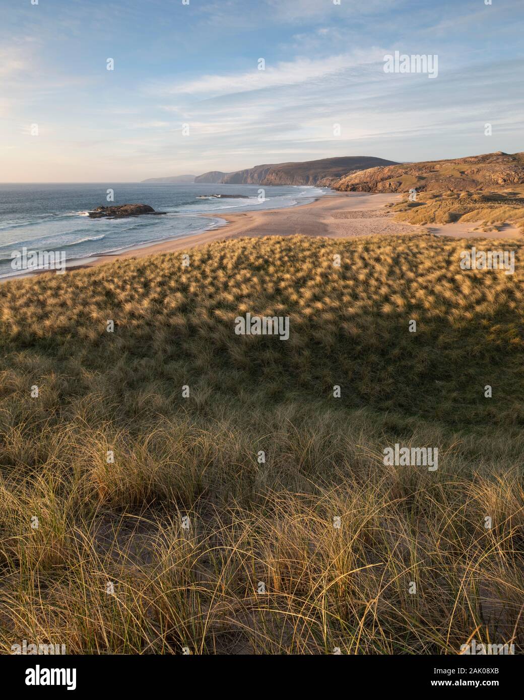Grass sand dunes and beach at isolated Sandwood bay, Sutherland ...