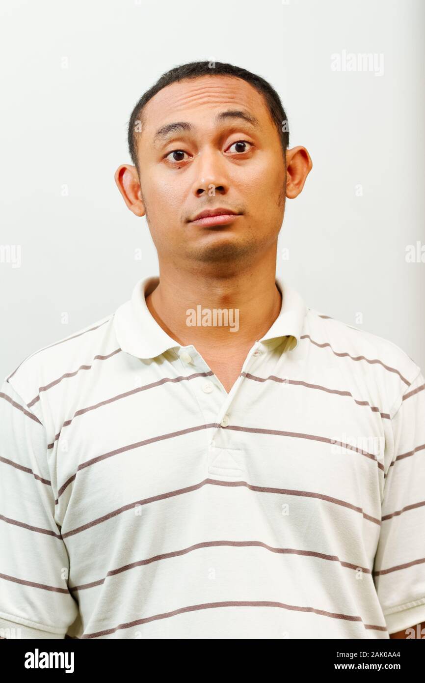 ethnic asian young male with confused face expression Stock Photo - Alamy