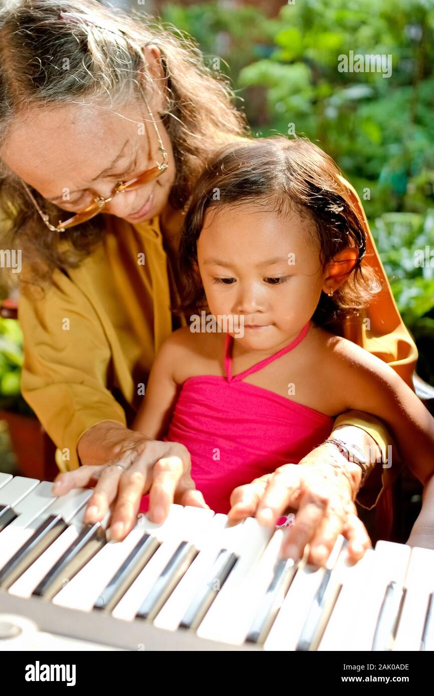 Ethnic family generations playing hi-res stock photography and images ...