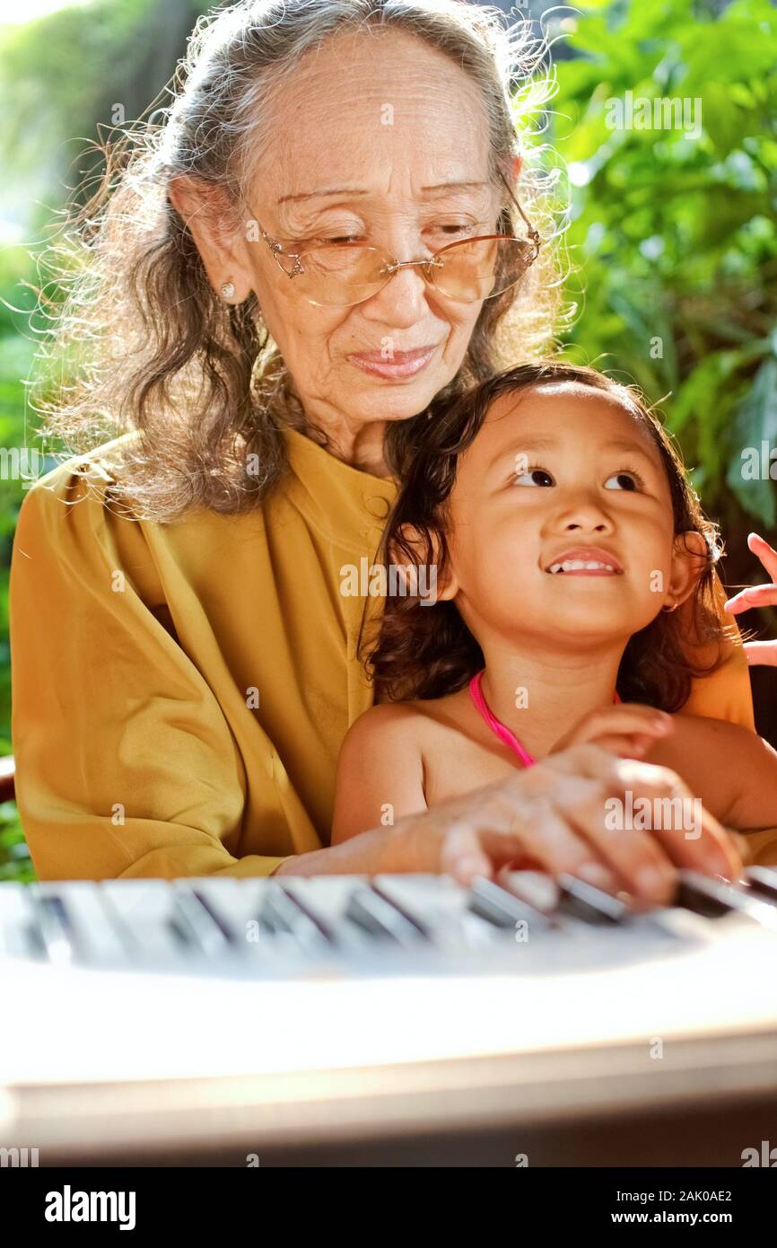 Ethnic family generations playing hi-res stock photography and images ...