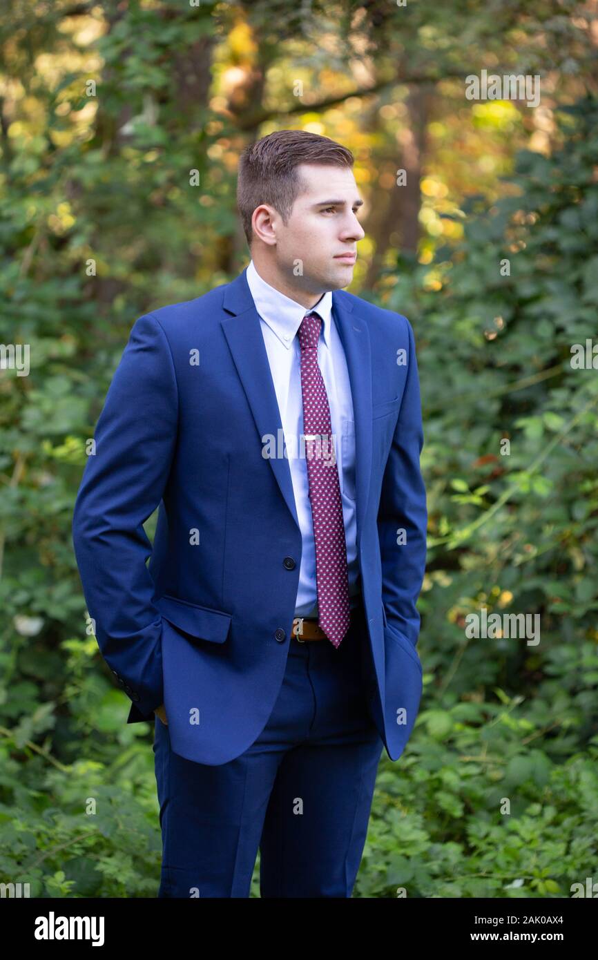 Serious young man suit hi-res stock photography and images - Alamy