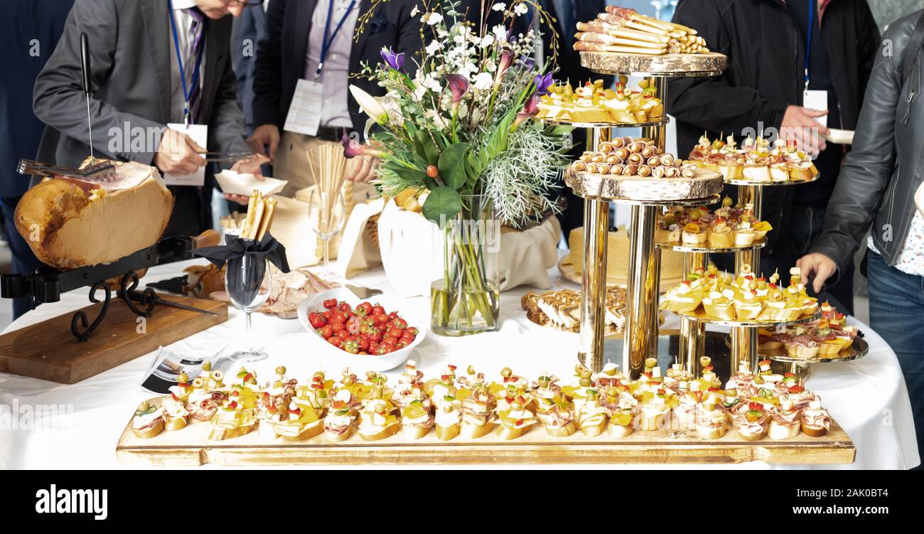 Businesspeople at banquet lunch break at business conference meeting ...