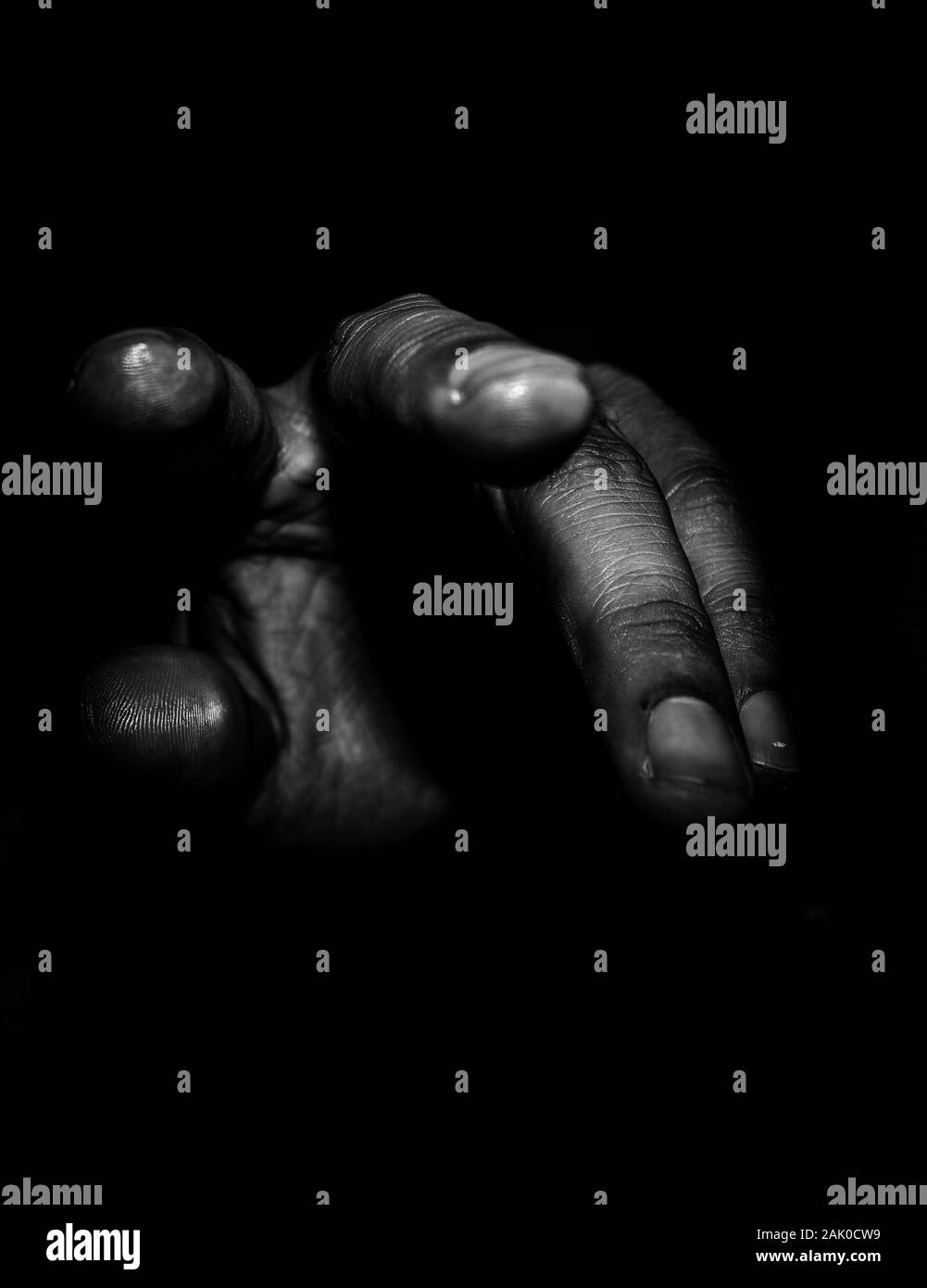 Hand in Darkness Stock Photo - Alamy