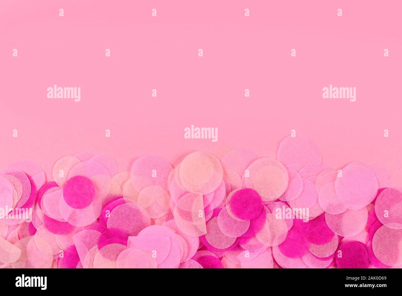 Background with pink paper confetti at bottom border and copy space ...