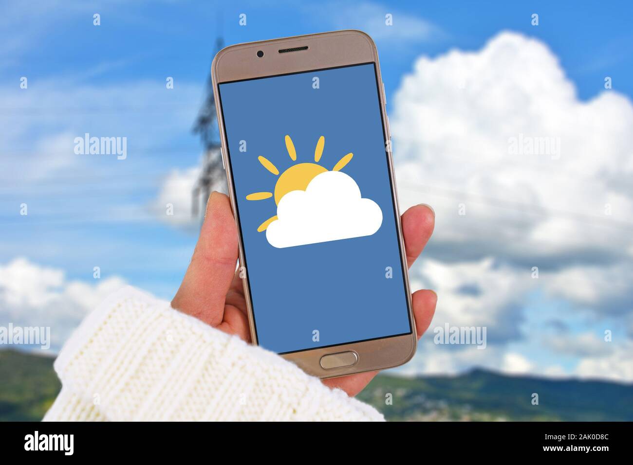 Weather forecast concept with hand holding mobile phone with icon of ...