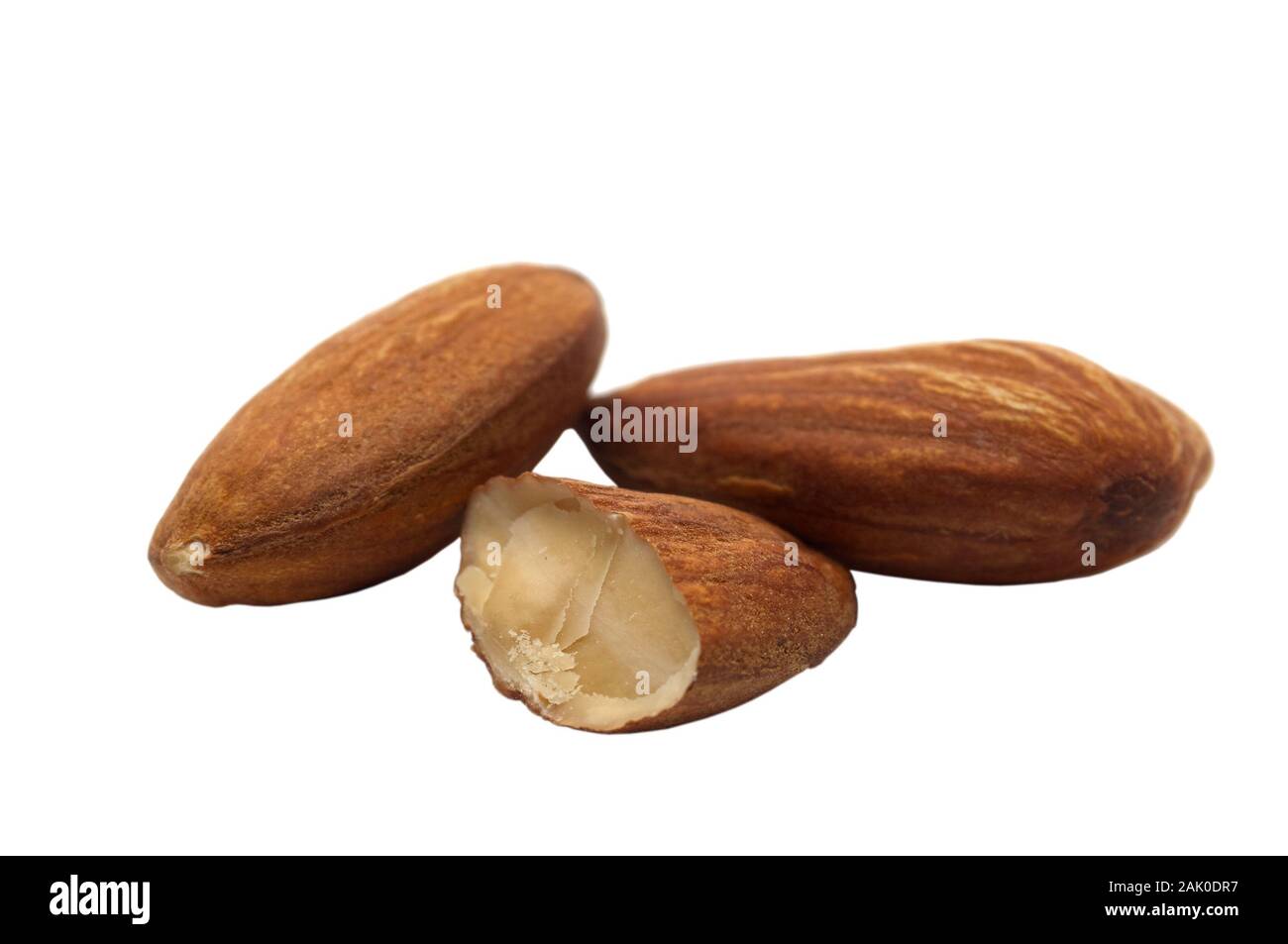 Almond close - up isolated on white. Whole almonds and half a nut ...