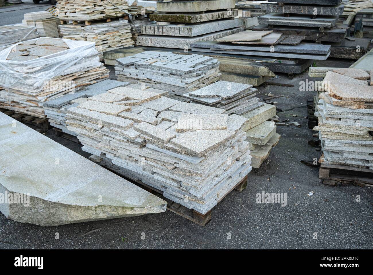 Piles of granite marble slabs on cutting factory. Stone sheets for ...