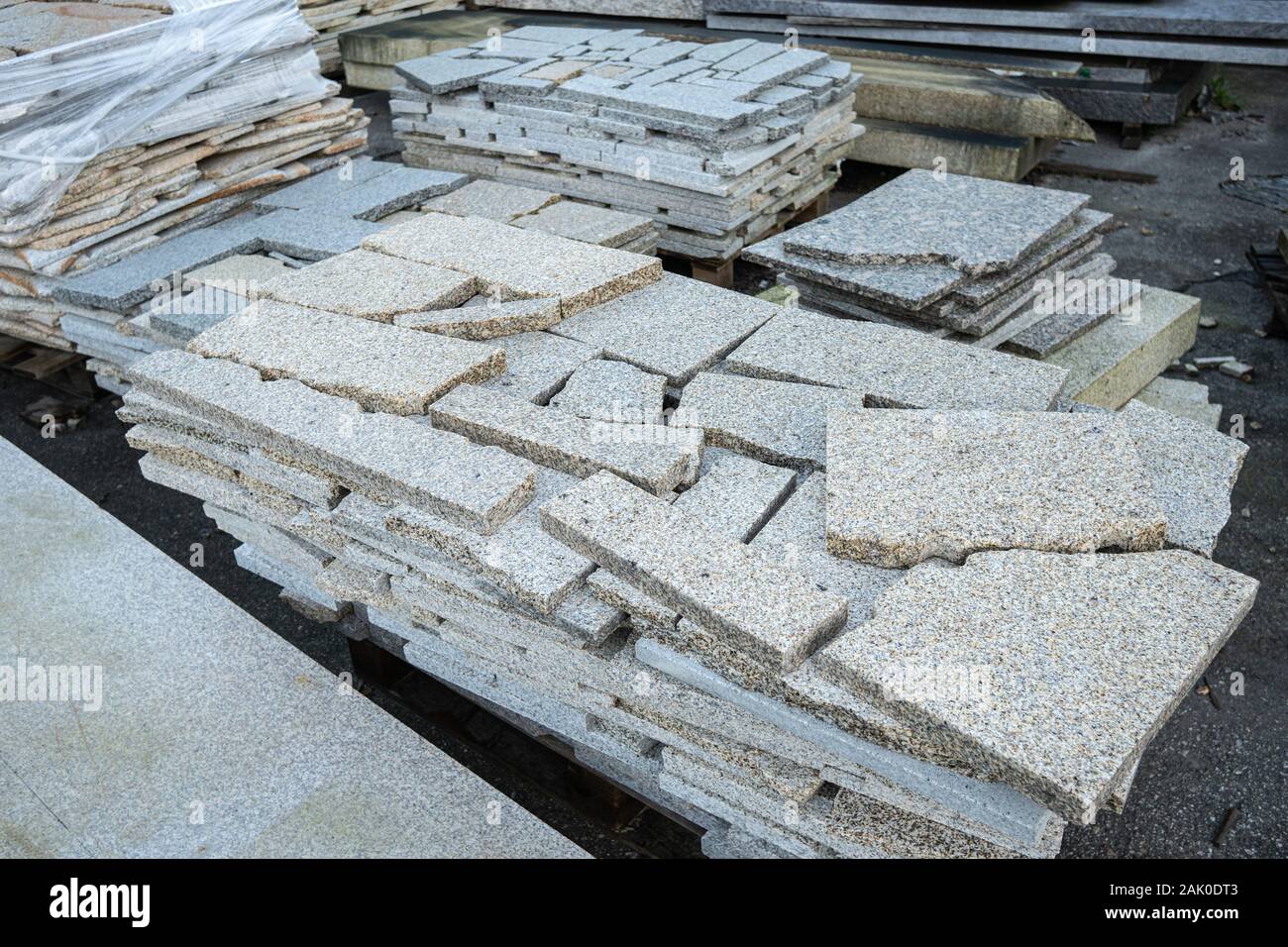 Piles of granite marble slabs on cutting factory. Stone sheets for ...