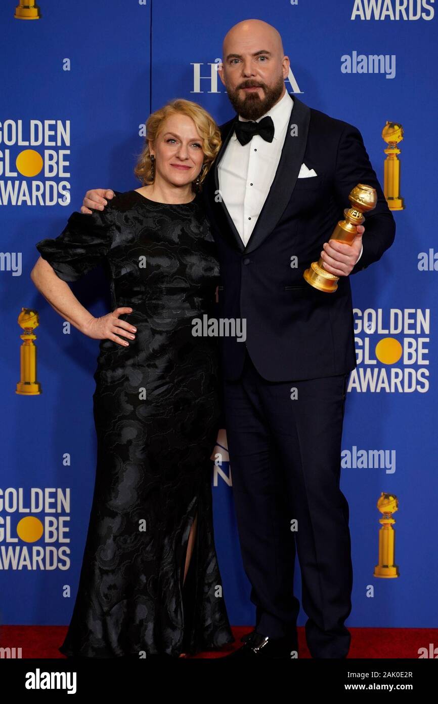 Arianne Sutner, left, and Chris Butler pose in the press room with the ...