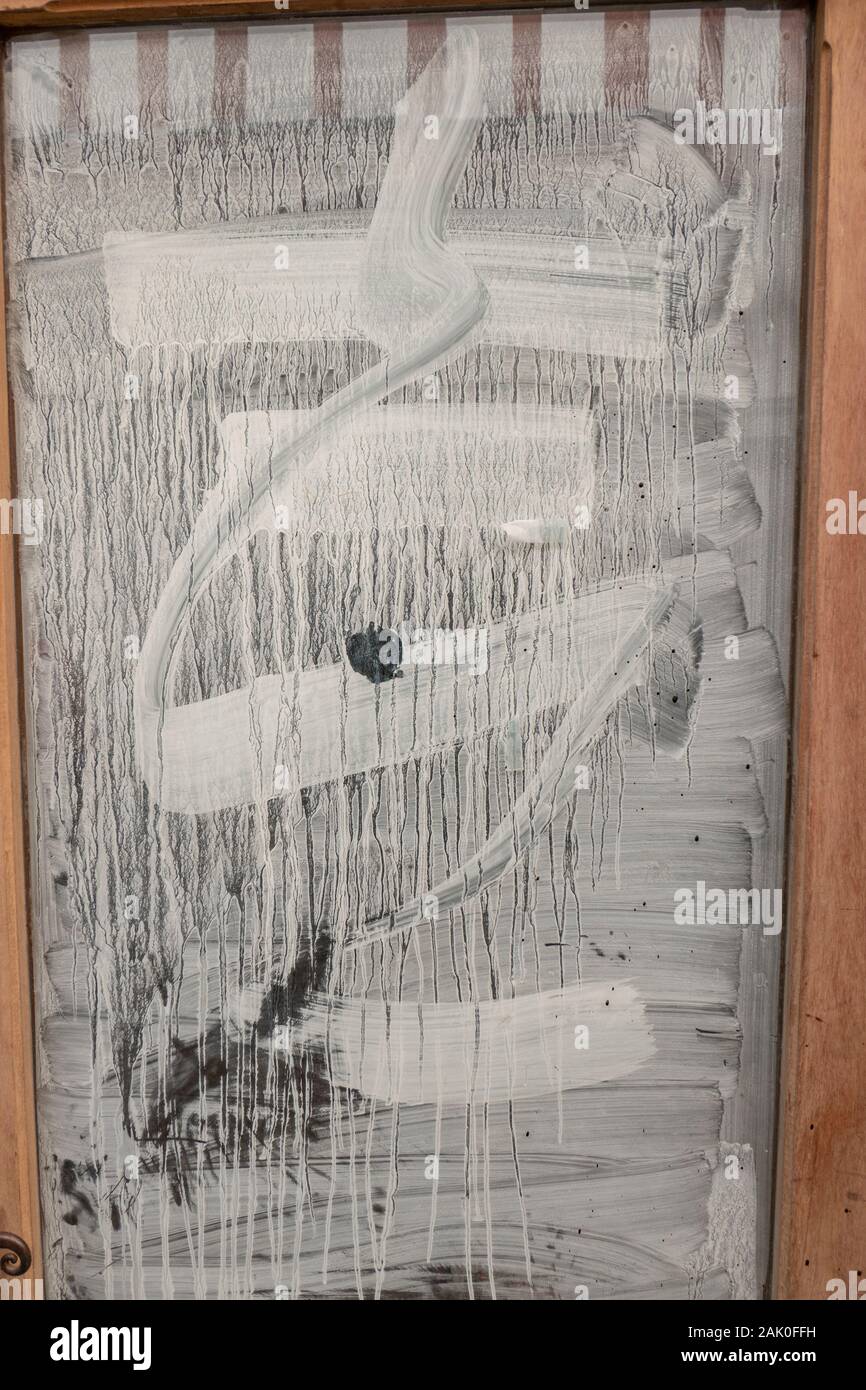Very dirty dusty window at a shop Stock Photo - Alamy