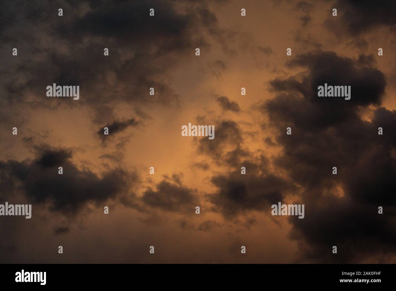 Cloudy evening sky lit by the setting sun Stock Photo - Alamy