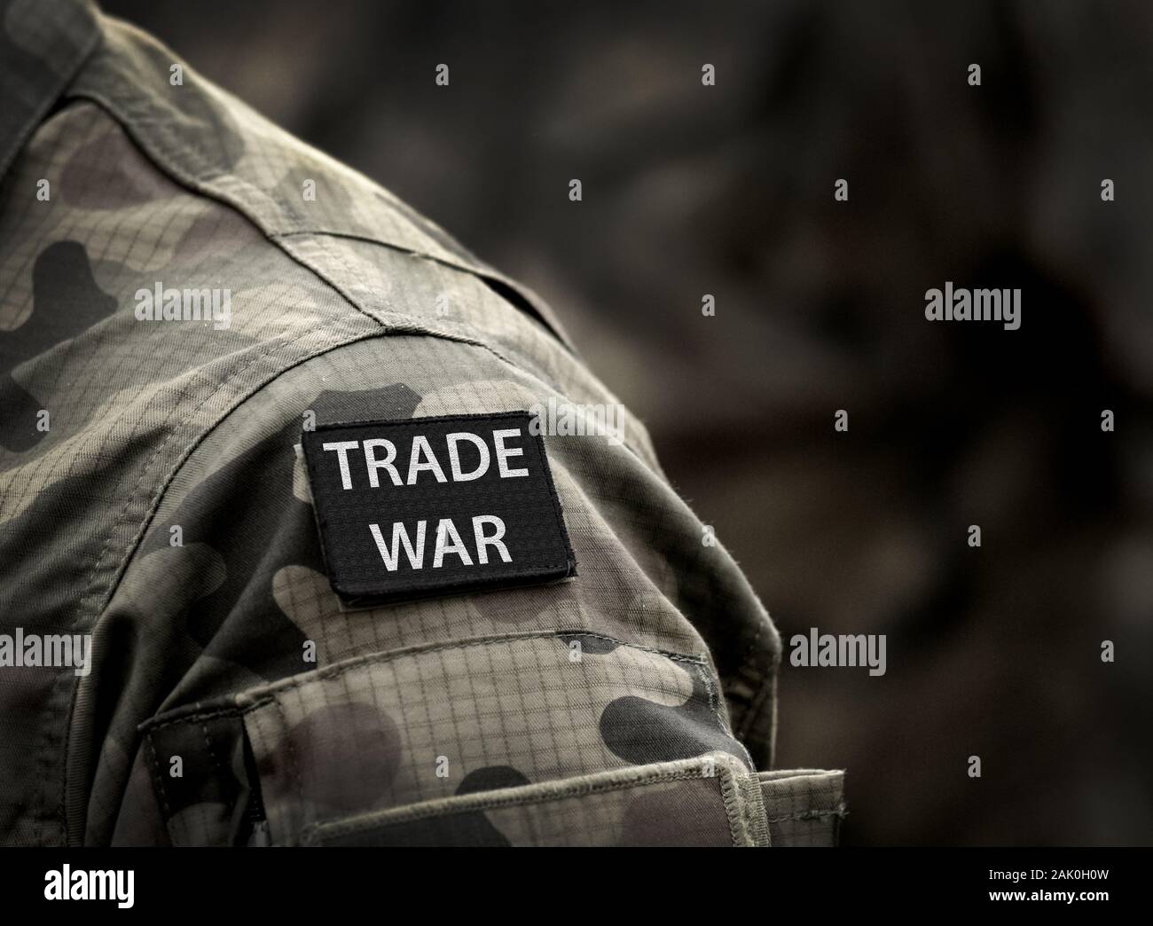 trade war concept. inscription trade war on military uniform Stock ...