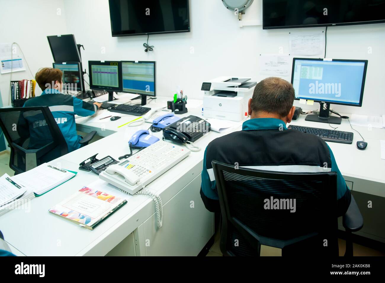 Workers in control room of polypropylene factory Stock Photo - Alamy