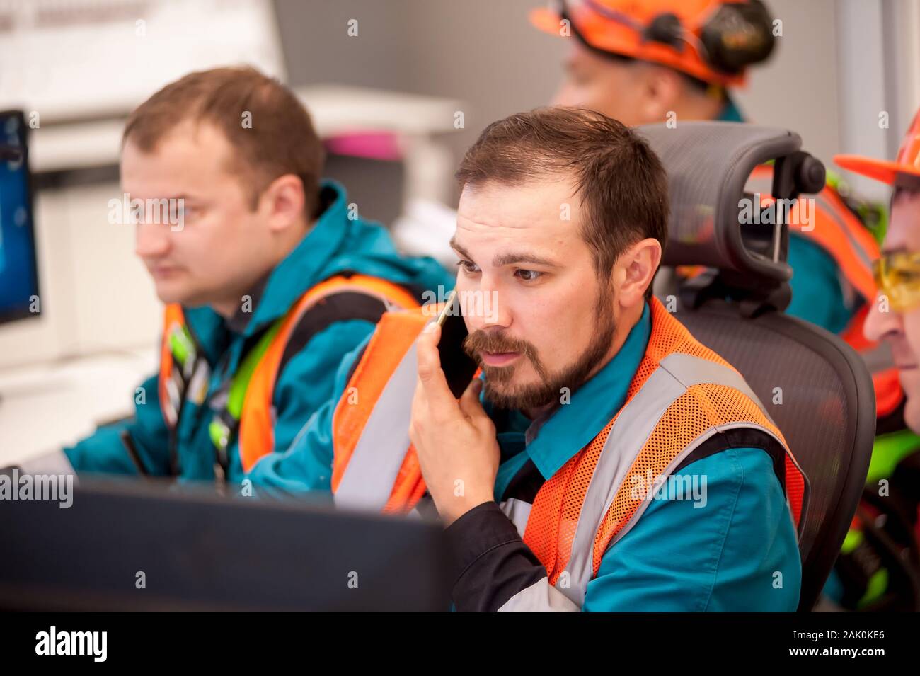 Men in control room of polypropylene factory Stock Photo - Alamy