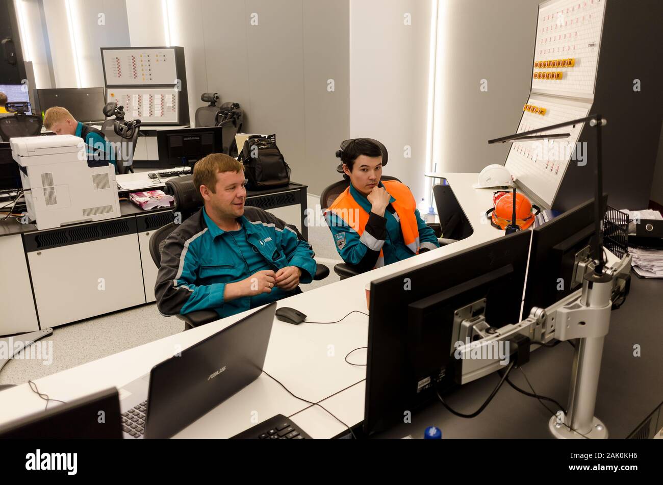 Men in control room of polypropylene factory Stock Photo - Alamy