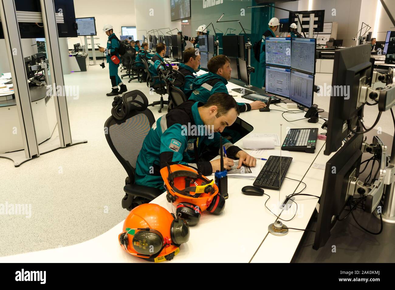 Engineers in industrial control room Stock Photo - Alamy