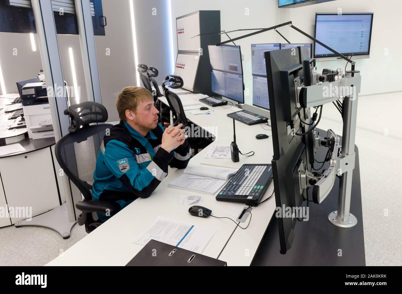 Engineer in industrial control room Stock Photo - Alamy