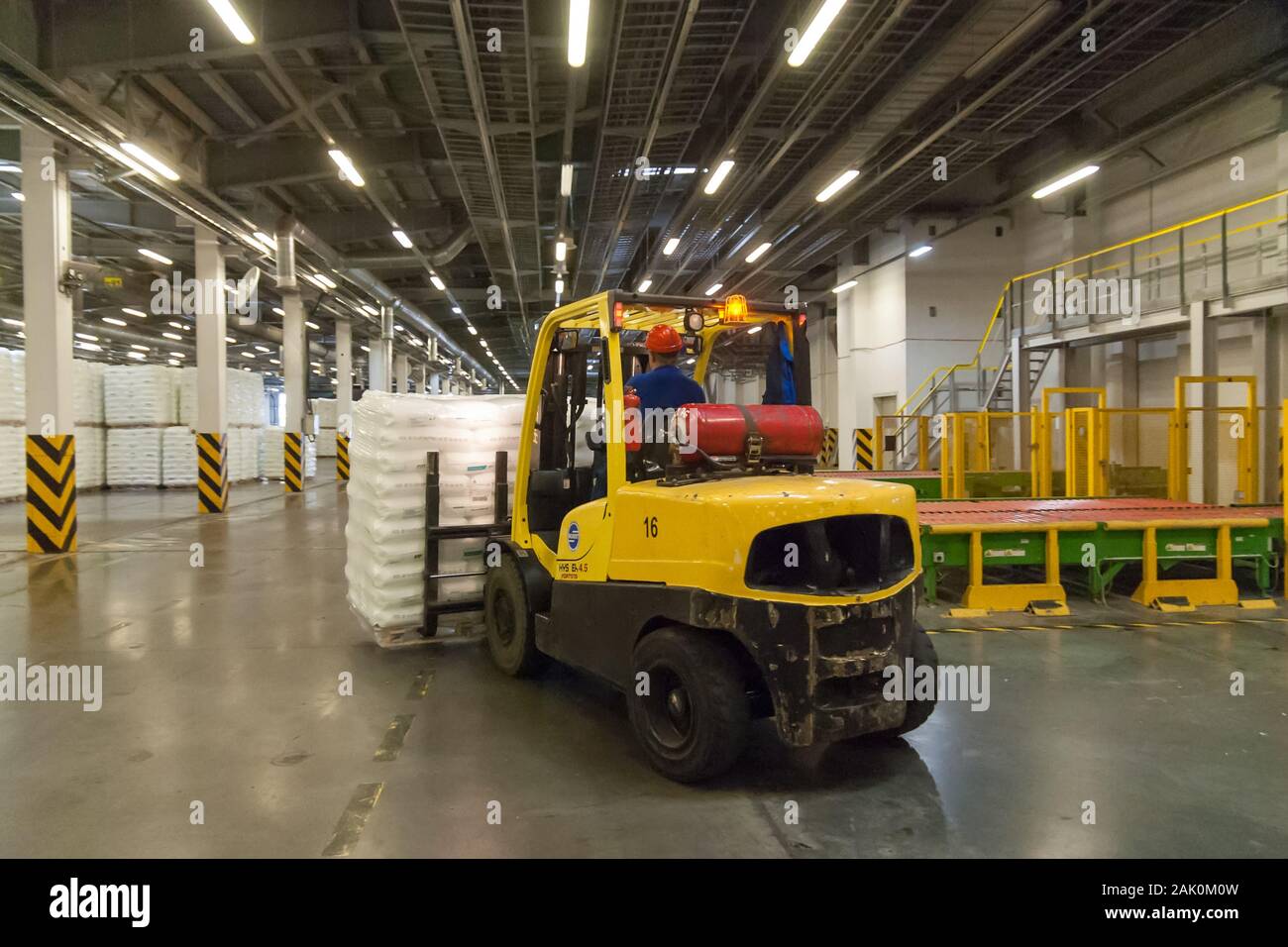 Forklift truck loads pallets with finished goods Stock Photo - Alamy