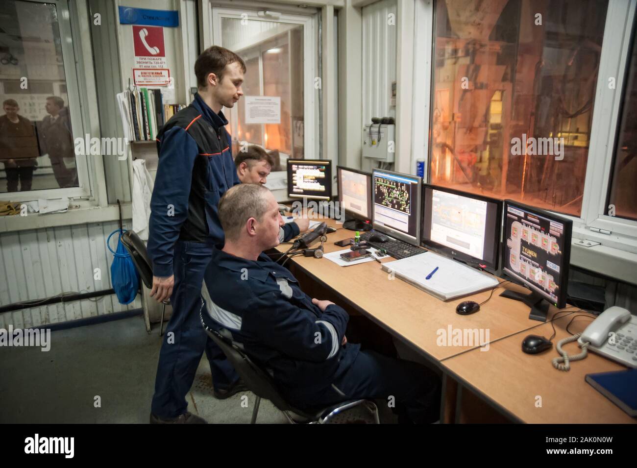 Engineers in control room of glass factory. Tyumen Stock Photo - Alamy