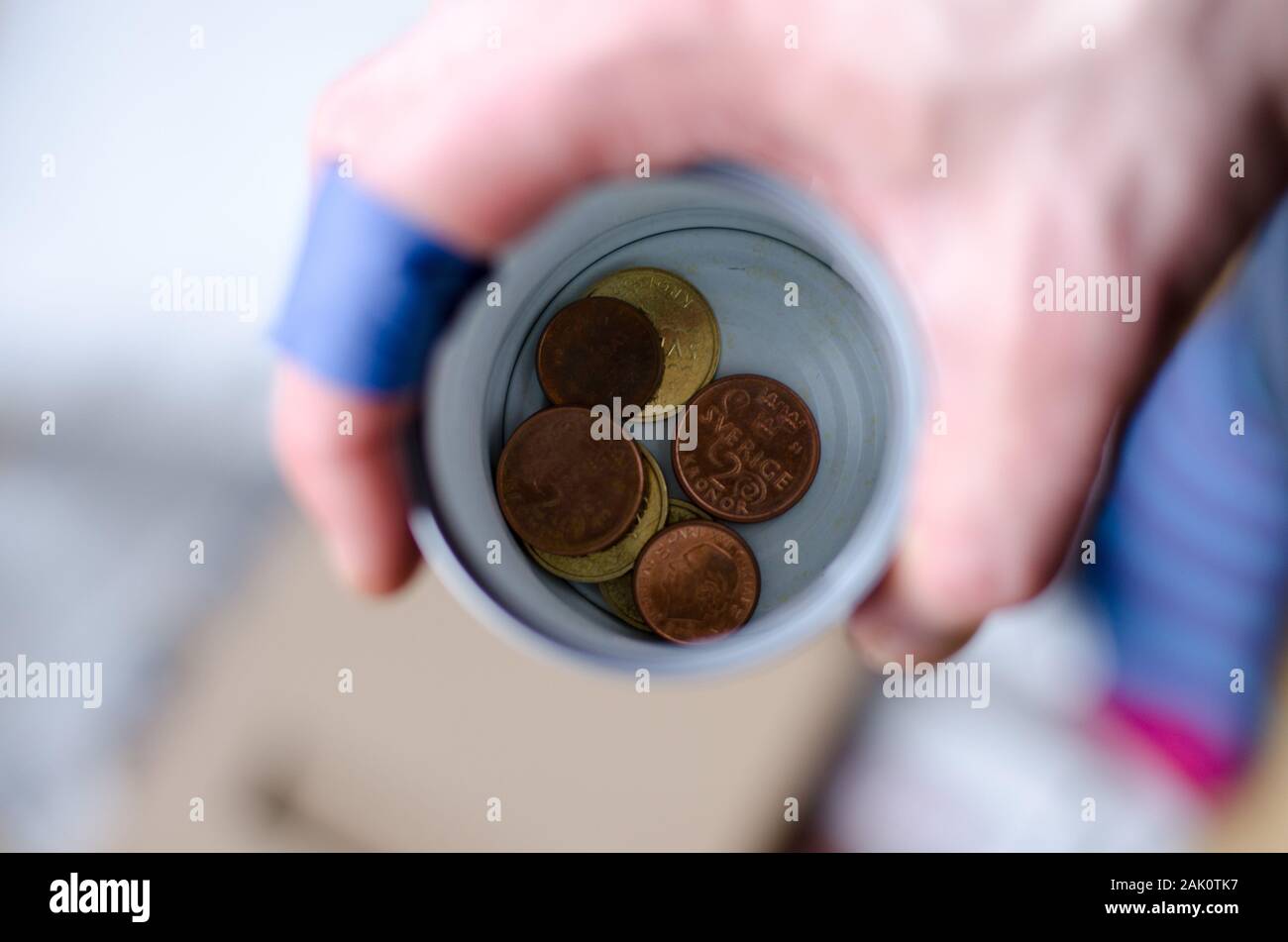 Begging cup hi-res stock photography and images - Alamy