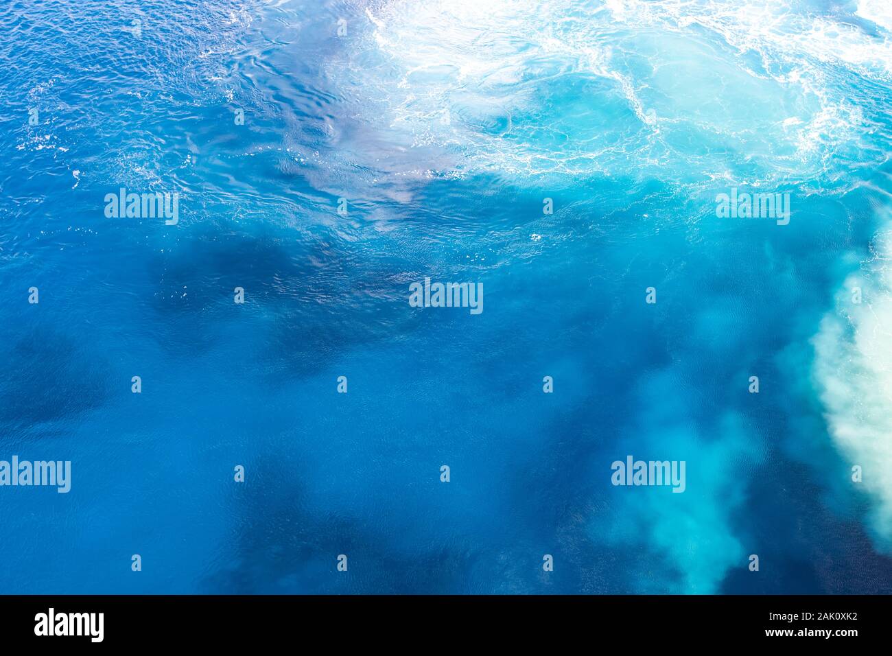 rippled and churned water from a cruise ship turning in St. Maarten ...