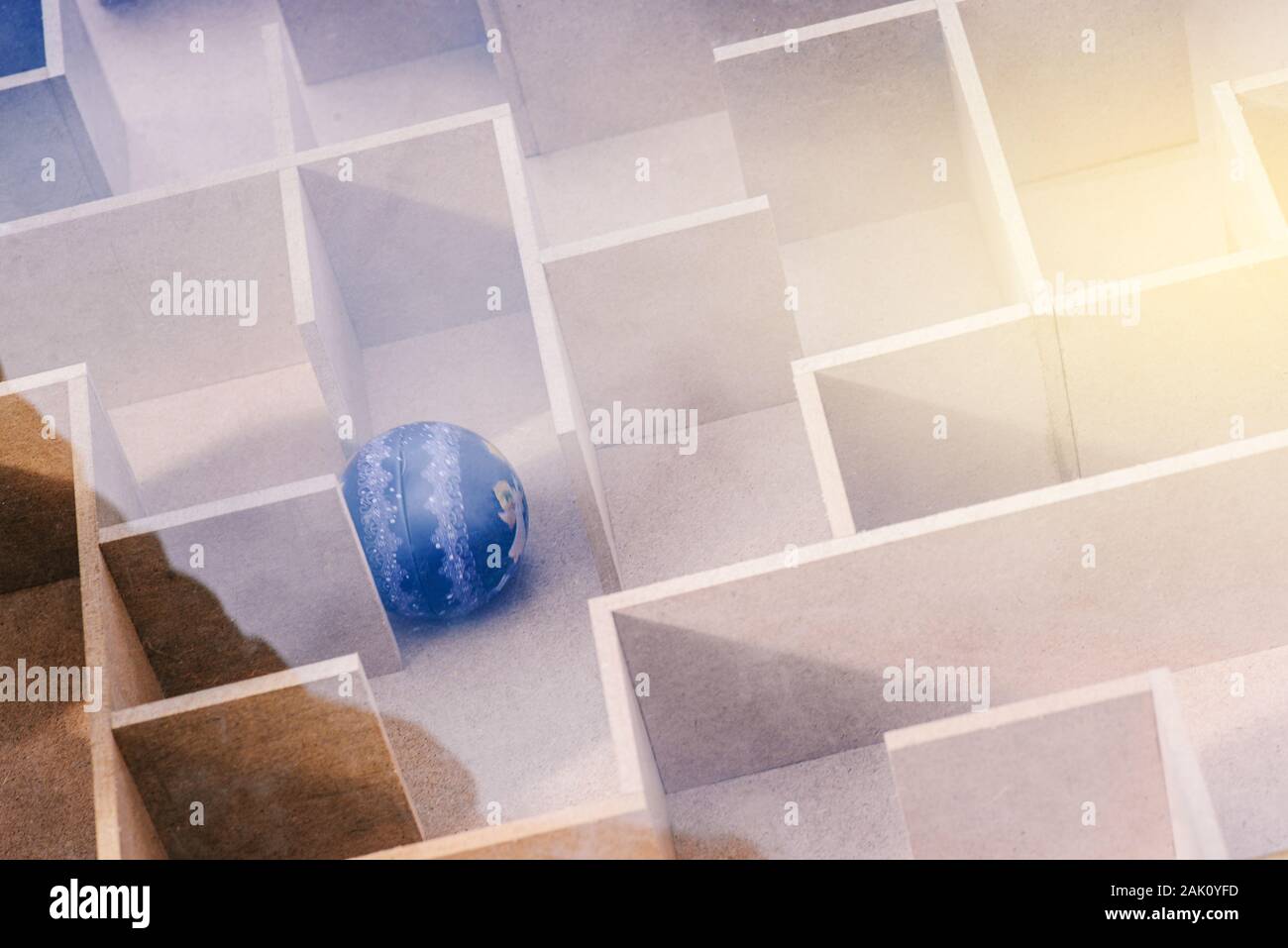Labyrinth with a ball. Wooden large maze and blue ball. Search for a ...