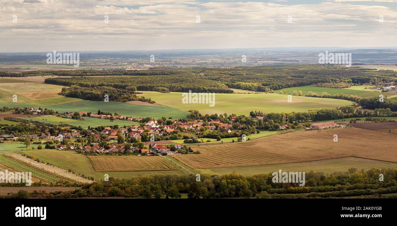 rural landscape with village (Ctineves) and fields, blue sky with white ...