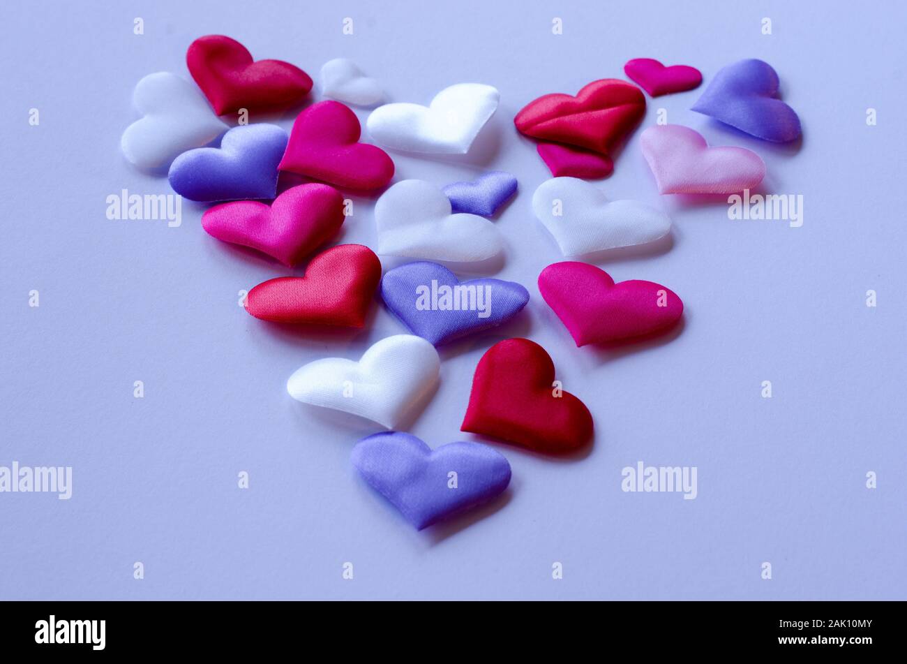Hearts in different colors and sizes on white background Stock Photo ...